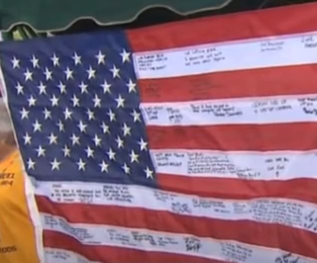 Man Finds $5 Flag At Flea Market With Writing On Stripes